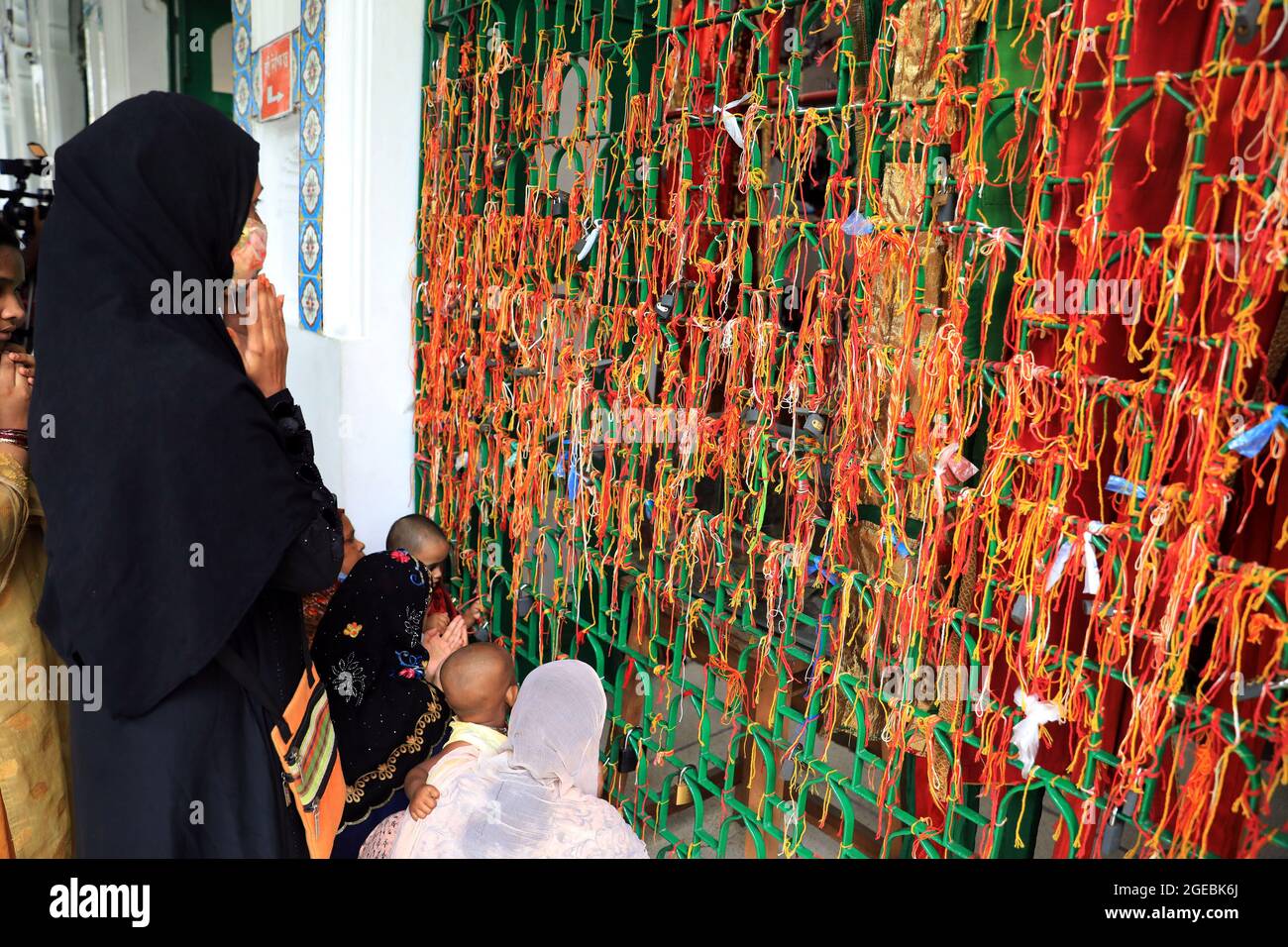Dhaka, Bangladesh, August 18, 2021: Muslim women tie the Tajia as ...