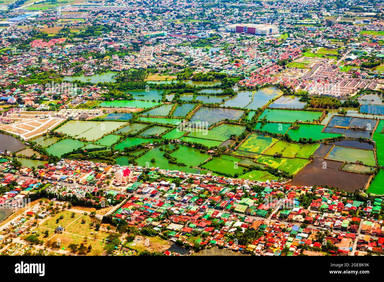 Manila suburb with small houses and rice fields aerial panoramic view ...