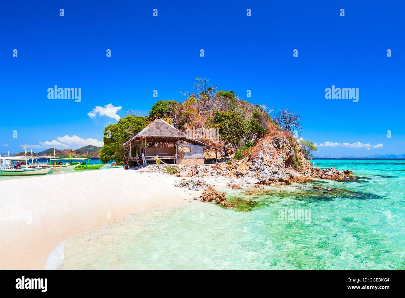Beauty rocky beach with yellow sand and turquoise water in Busuanga ...