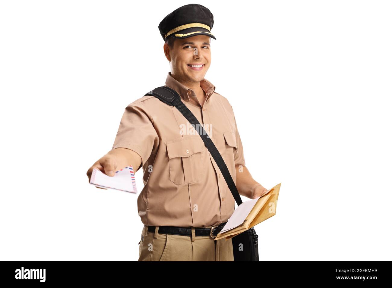 Smiling young mailman giving a letter isolated on white background ...