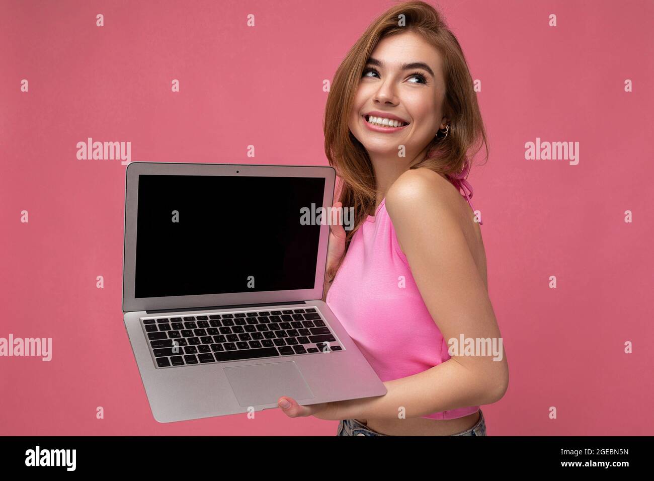 side profile photo of Happy smiling Beautiful young blond woman holding ...