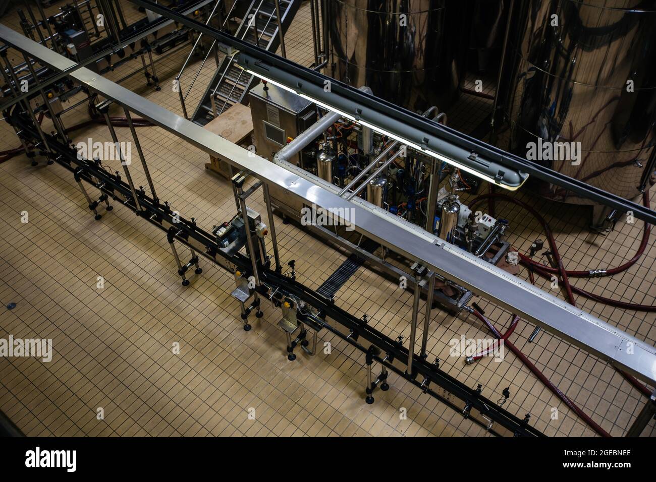 Modern winery production line. Storage vats and bottling equipment ...