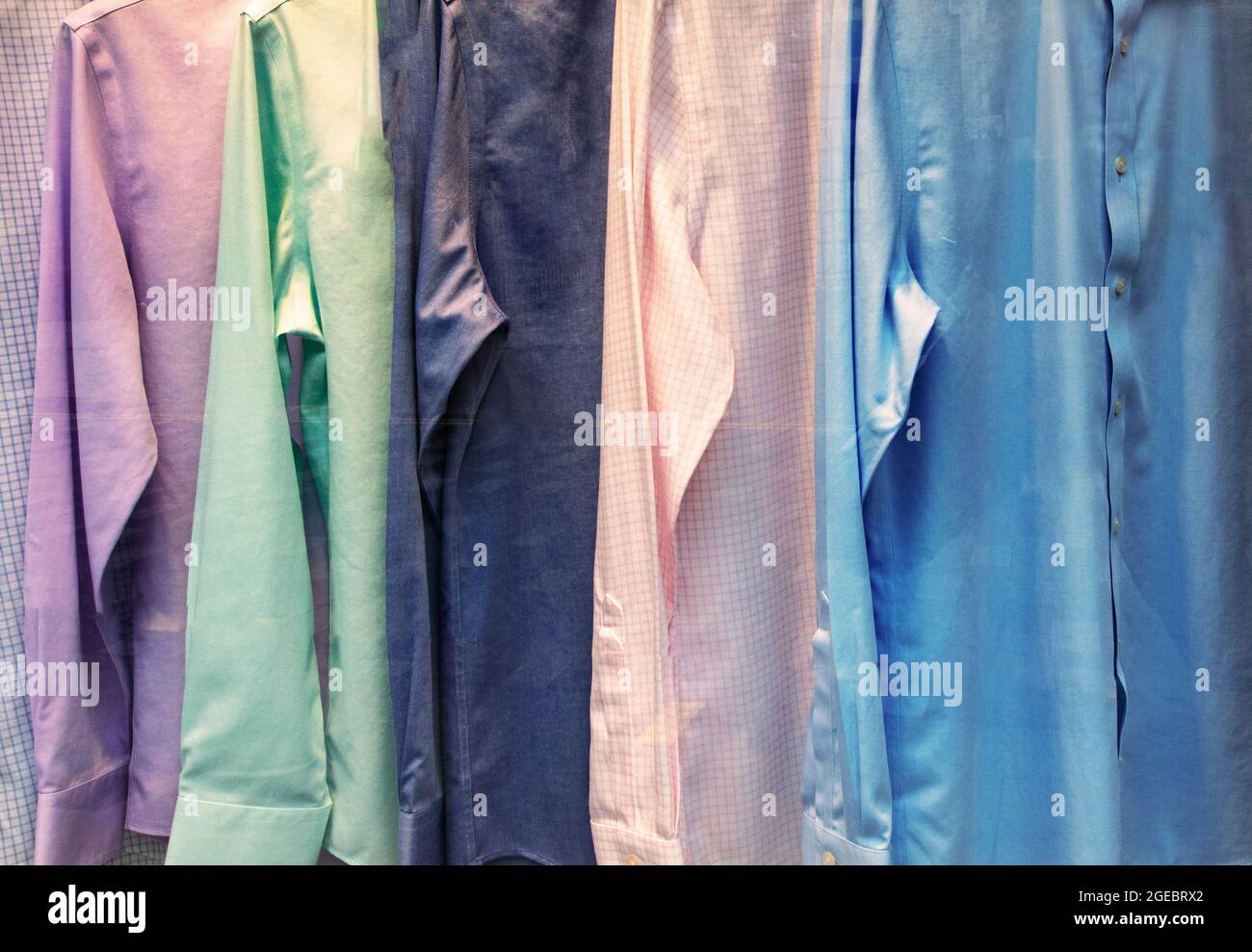 Men's shirts hanging on a rack in shop window in Jermyn St, London ...