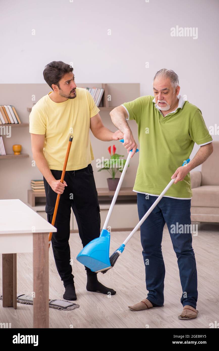 Father son sweeping floor hi-res stock photography and images - Alamy