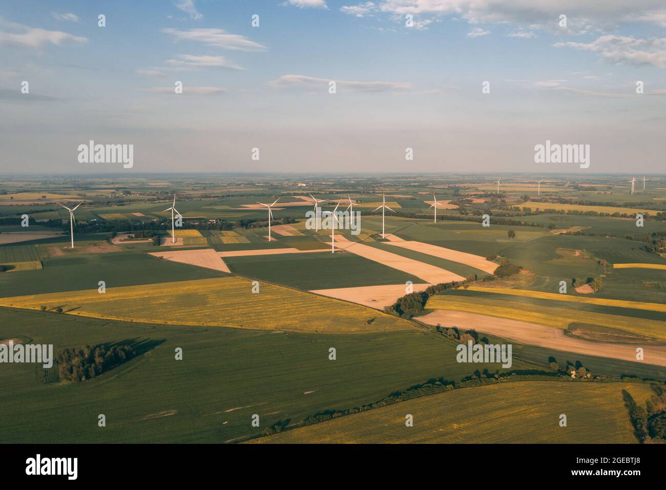 Drone photography of the wind turbine farm on the green fields of ...