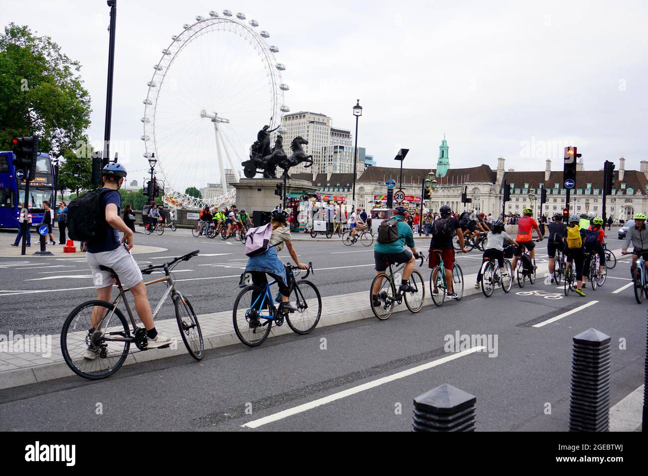 Line of cyclists on Westminster Bridge, London, United Kingdom Stock ...
