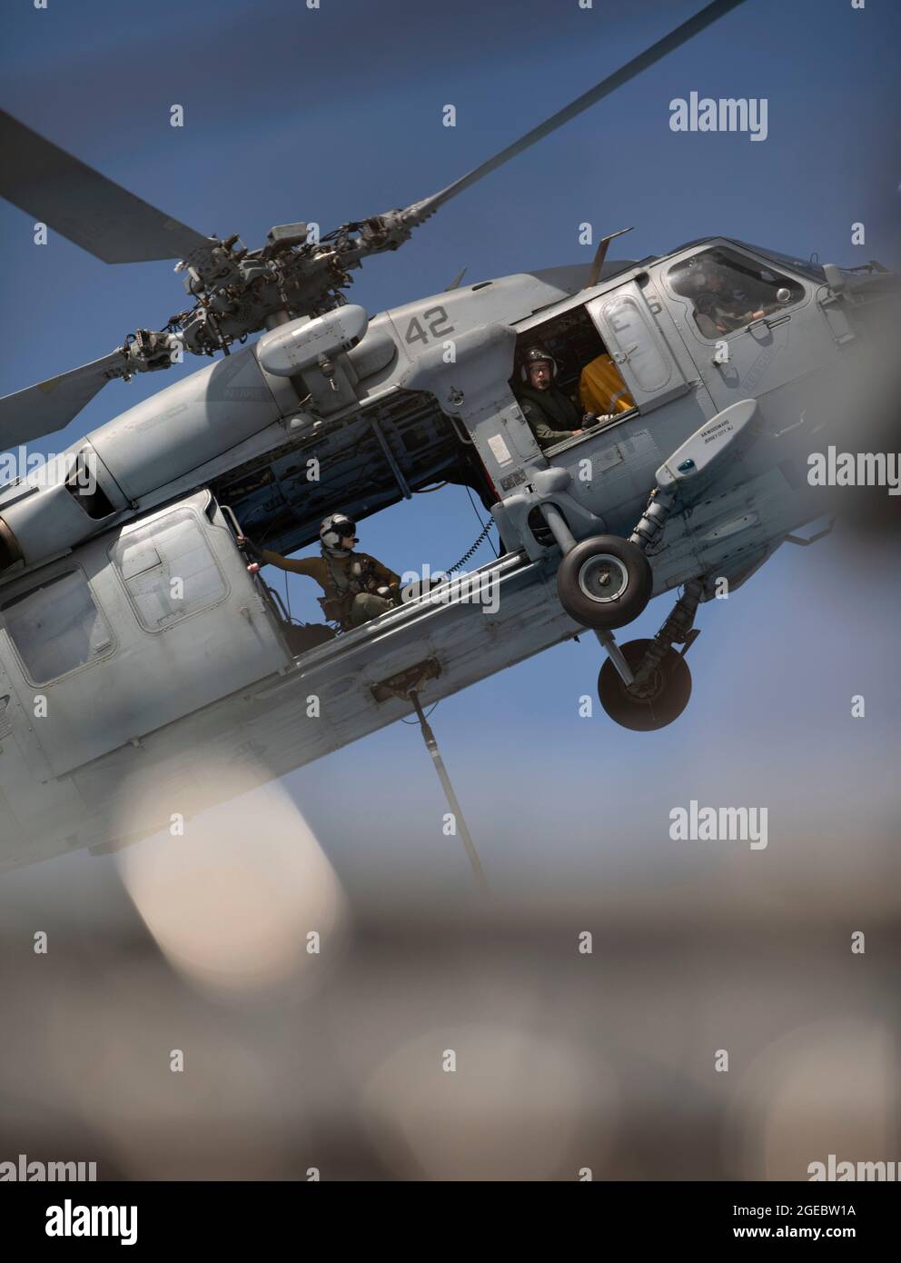 U.S. Navy pilots with Helicopter Sea Combat Squadron 28, transport ...