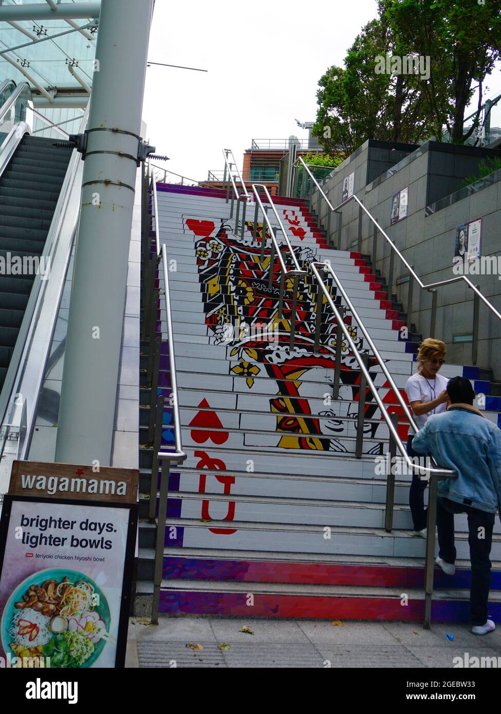Queen of heart on staircase at the Cardinal Place Shopping Centre ...