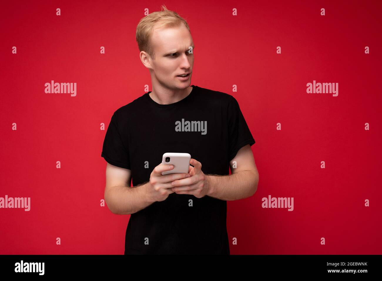 Handsome young man isolated over background wall wearing everyday ...