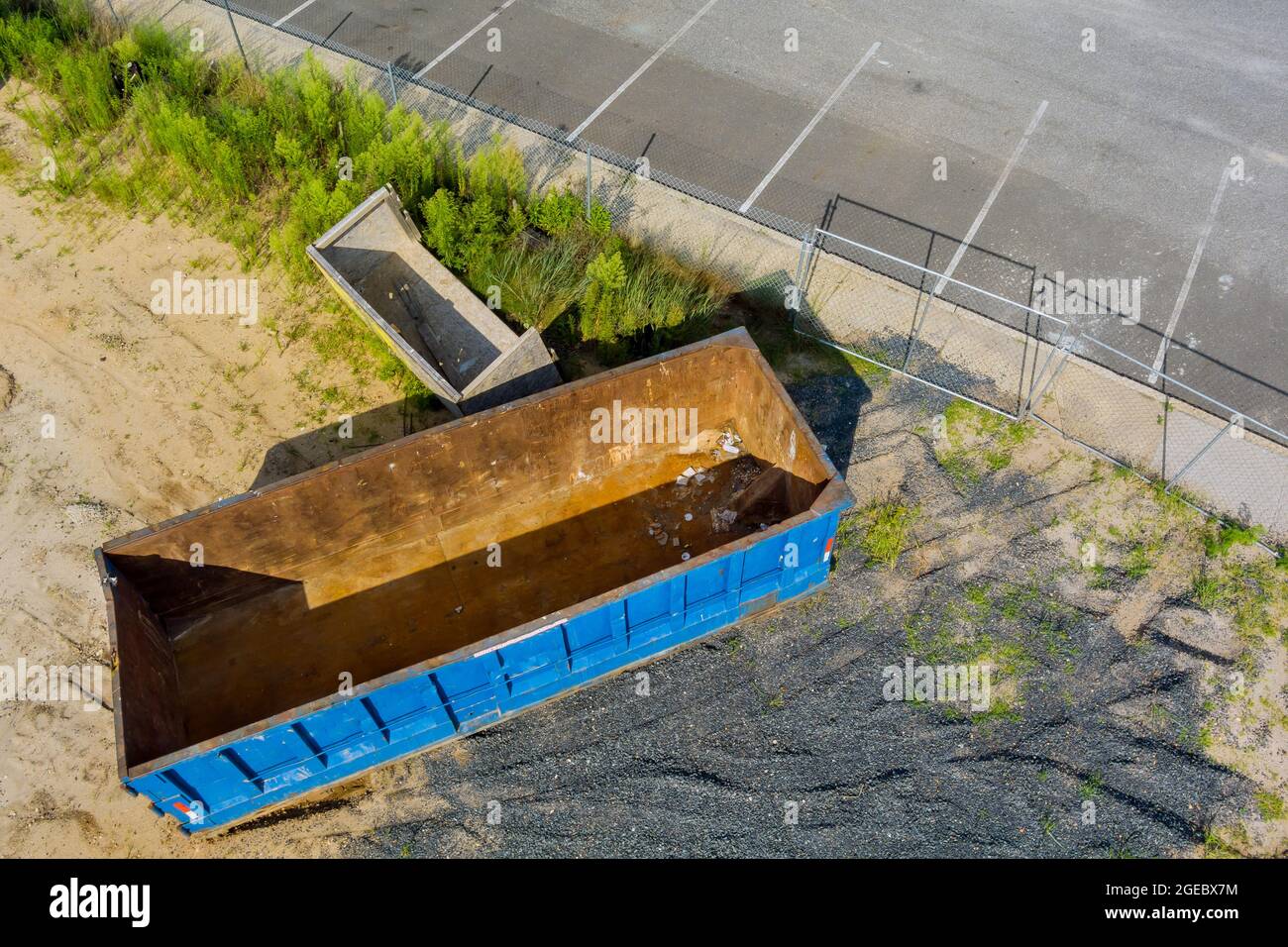Construction trash garbage dumpsters on metal container house ...