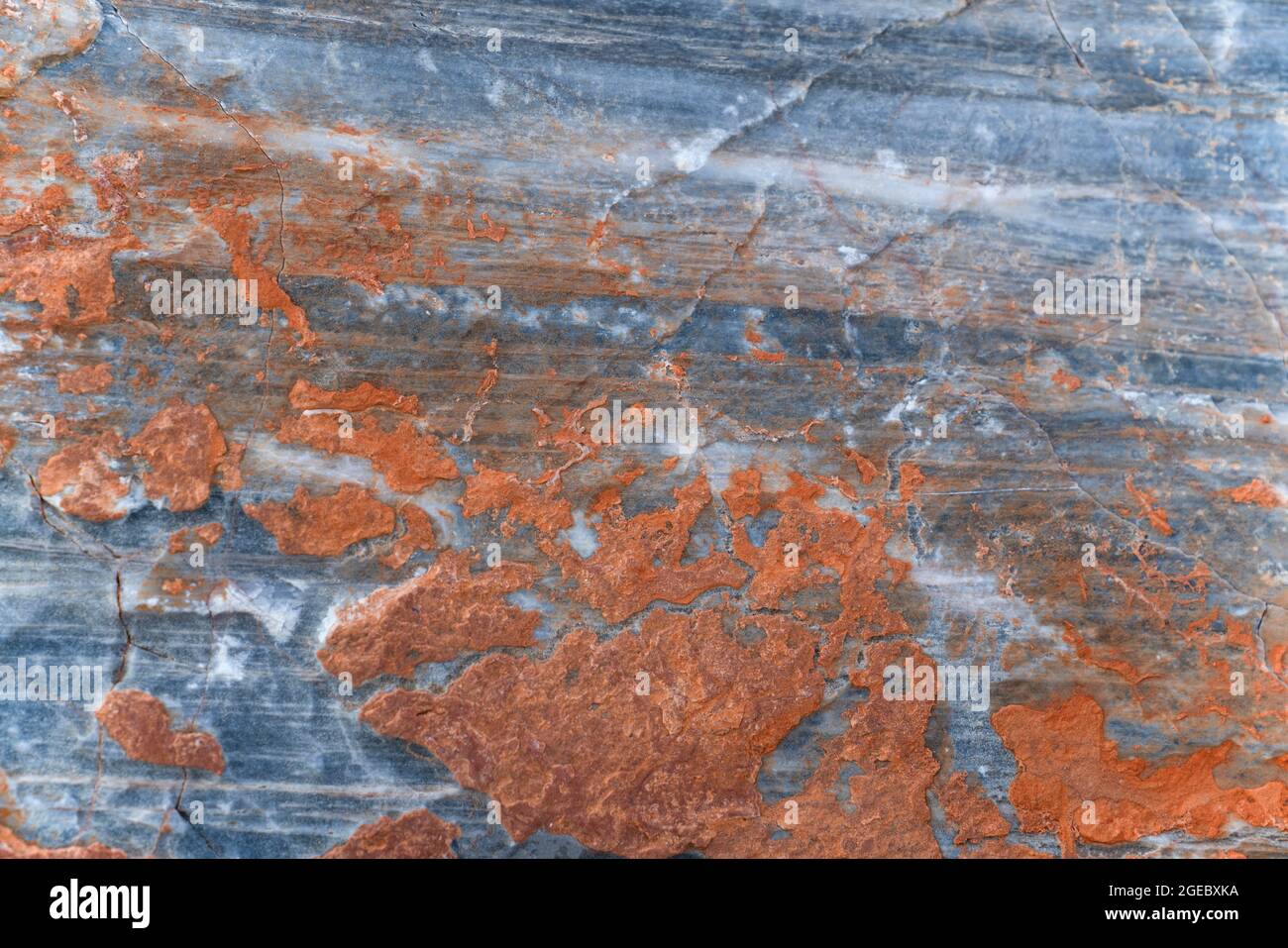 Orange rust coating on gray surface of stone. Background, texture Stock ...