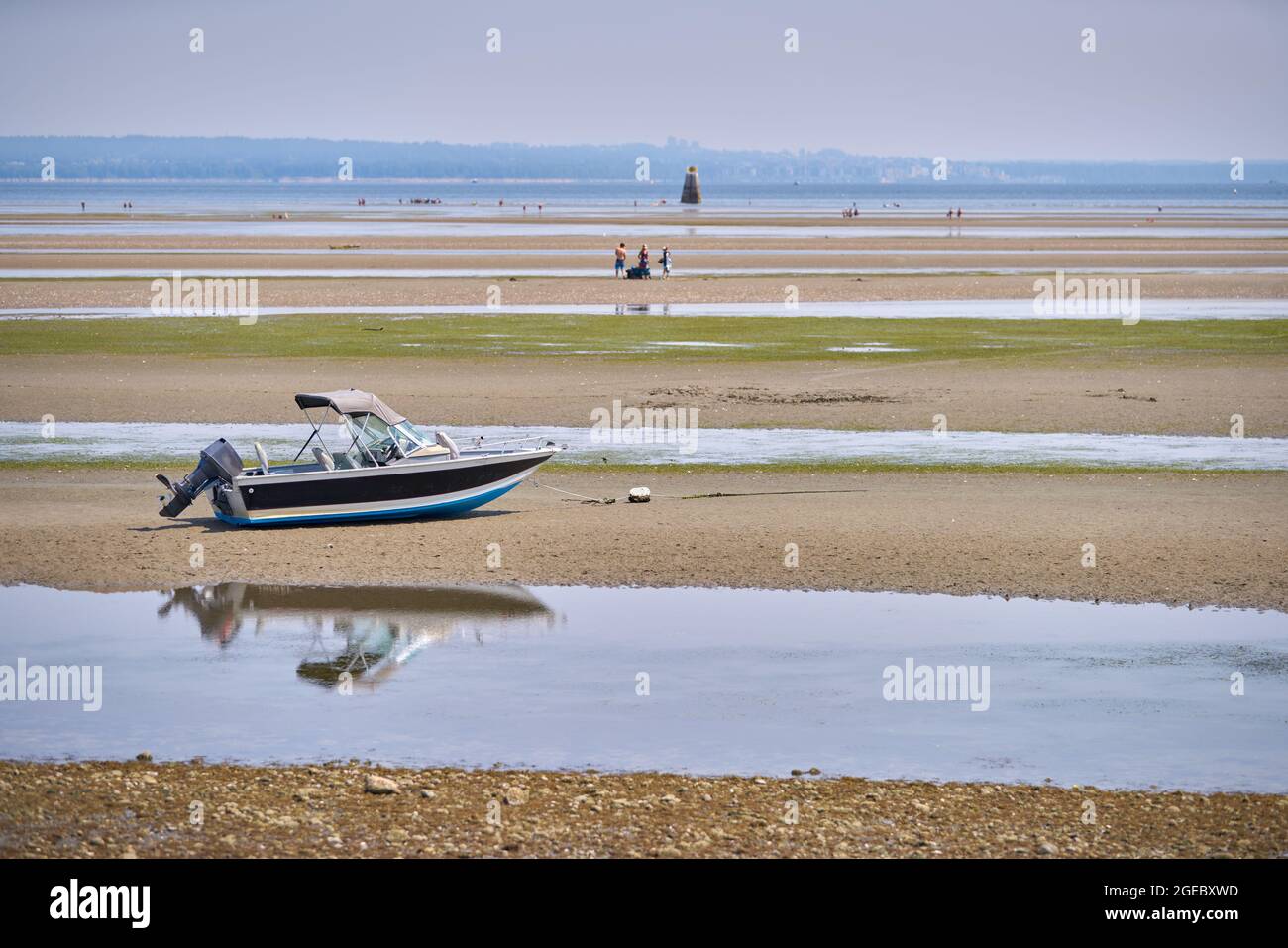 Maple Beach in Point Roberts USA. A boat beached on the sand at ...