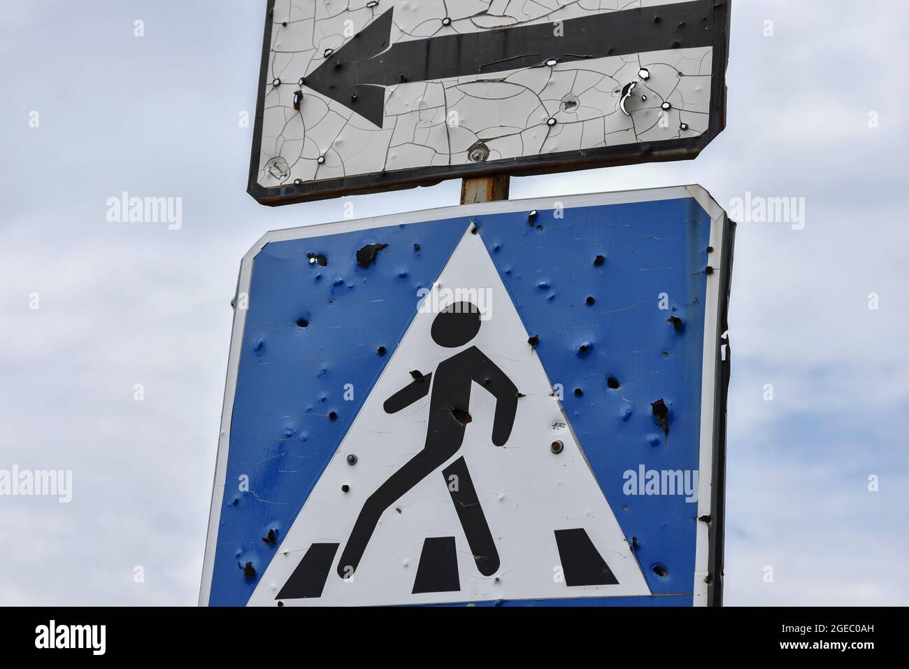 A damaged pedestrian road sign seen in Krasnohorivka. (Photo by Andriy ...