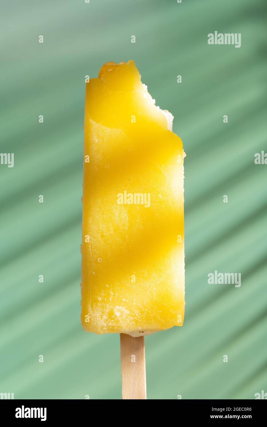 popsicle with a bite in a sunny morning near a window Stock Photo - Alamy