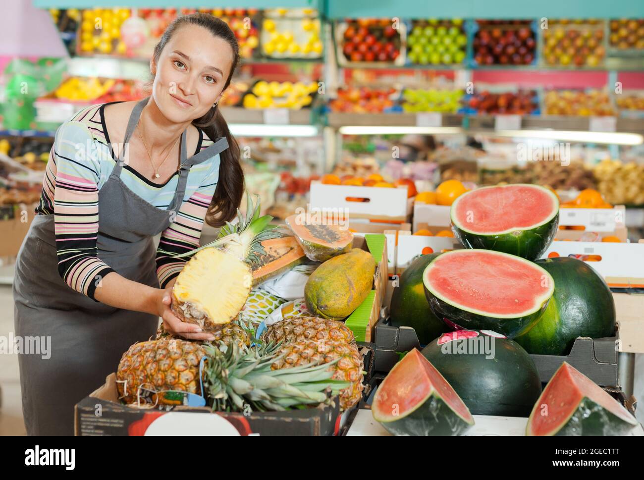 Ordinary woman store worker in supermarket Stock Photo - Alamy