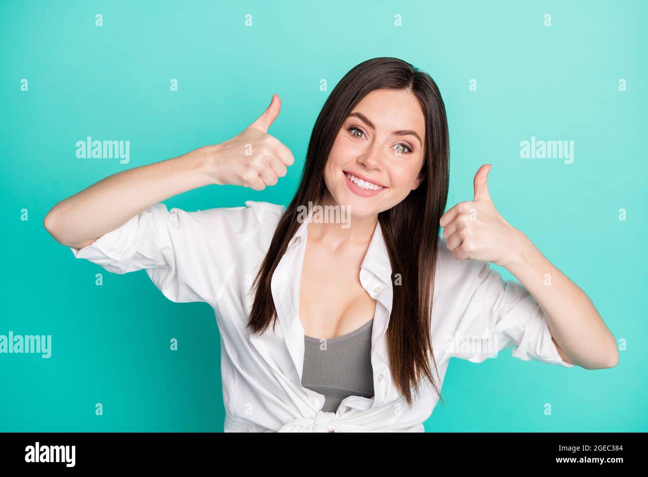Photo of attractive cheerful happy young woman make thumbs up smile ...