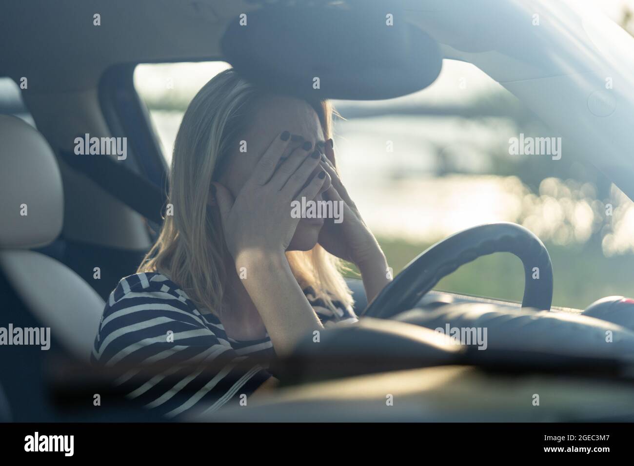 Stressed woman cry in car. Middle age lady driver hide face in hands ...