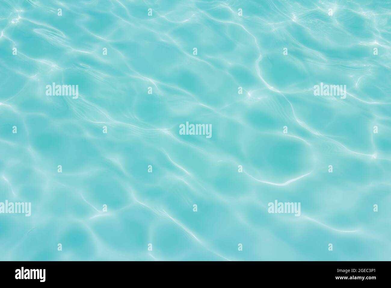 Blue swimming pool with sunny reflections background Stock Photo - Alamy