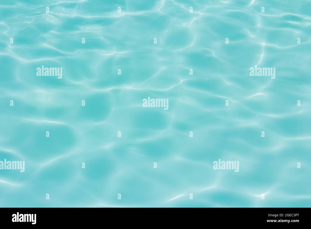 Blue swimming pool with sunny reflections background Stock Photo - Alamy