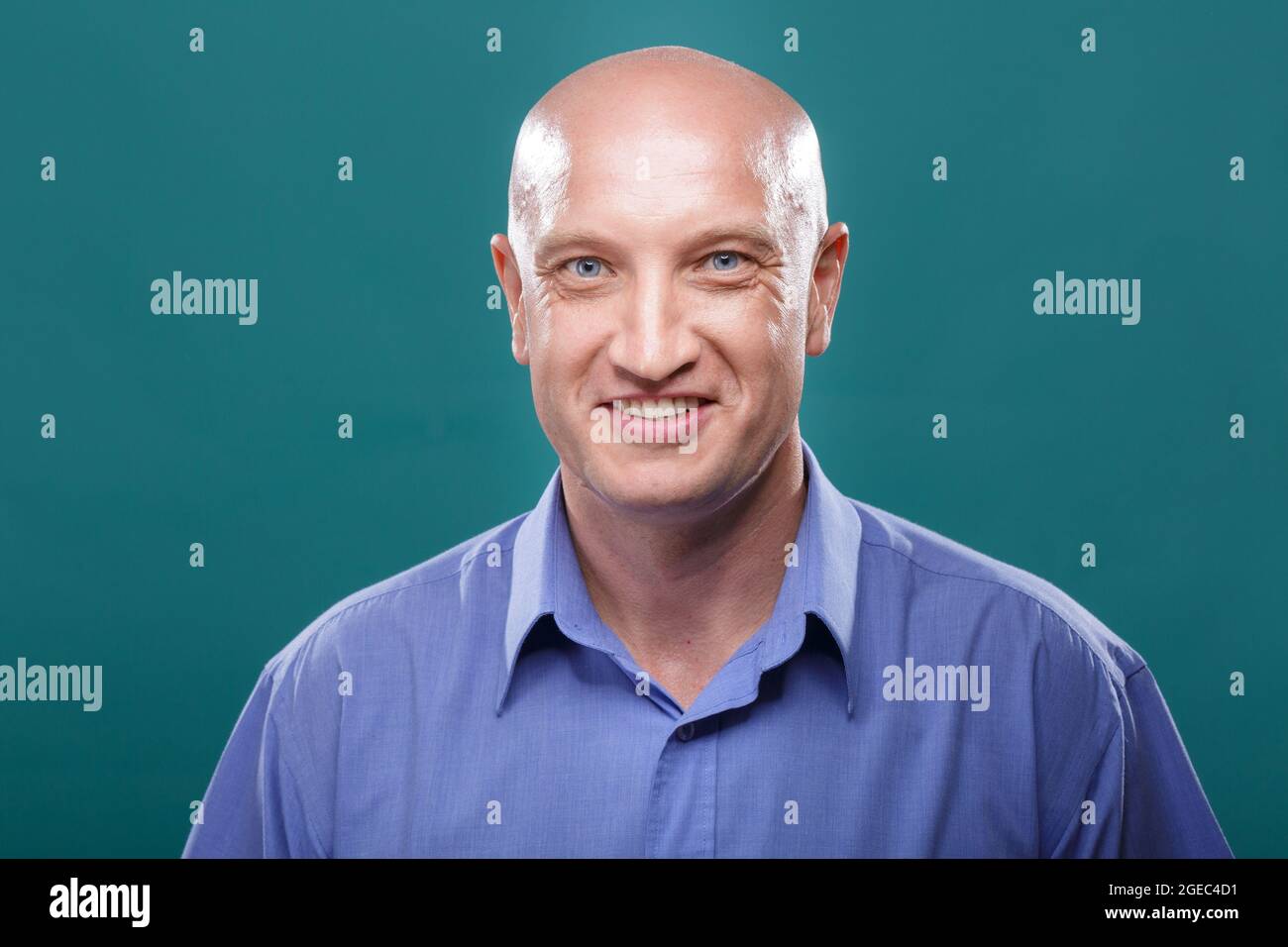 Portrait of a bald man on a blue background. Model in her 40s, blue ...