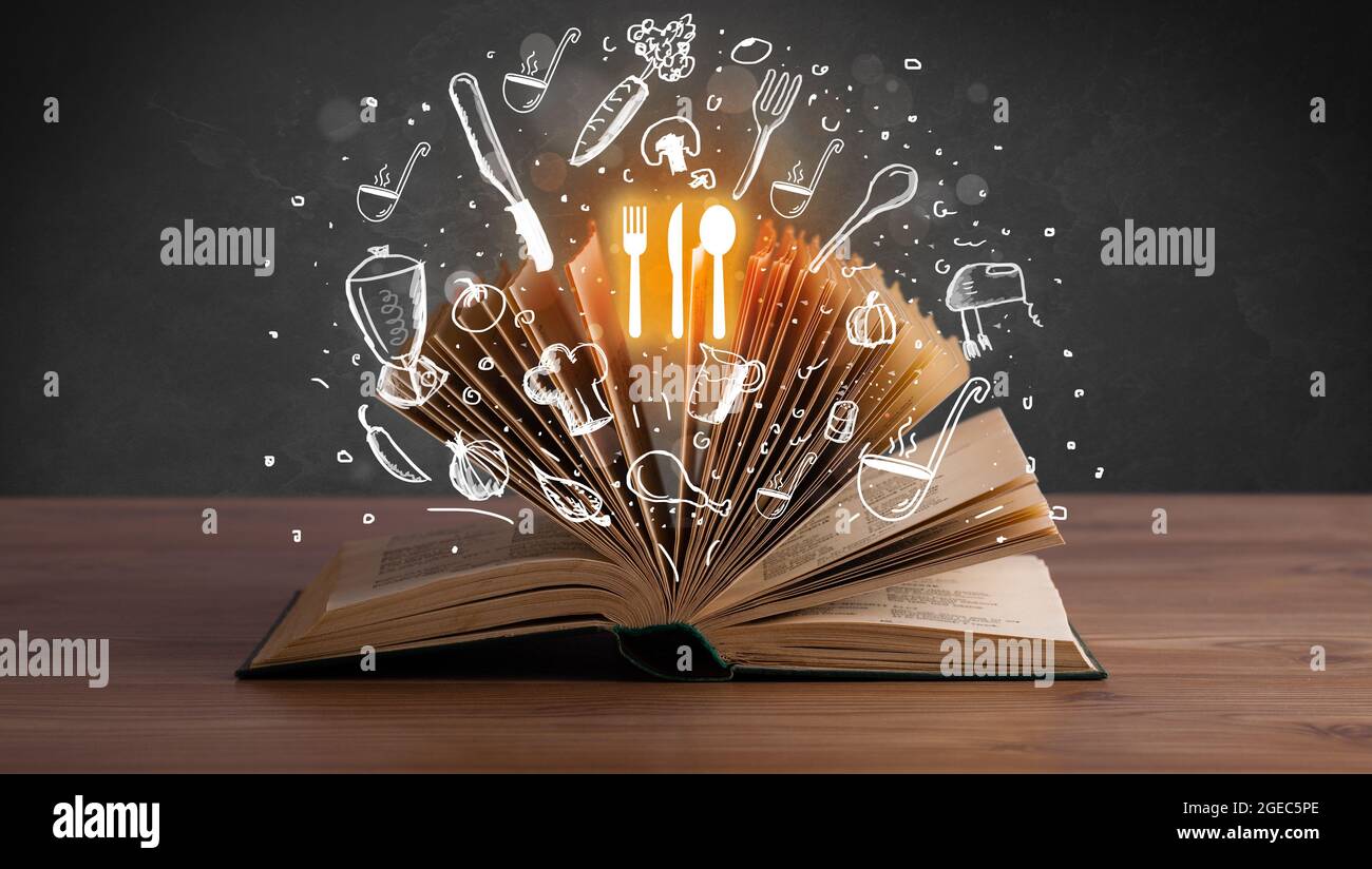 Open recipe book with food related icons above Stock Photo - Alamy