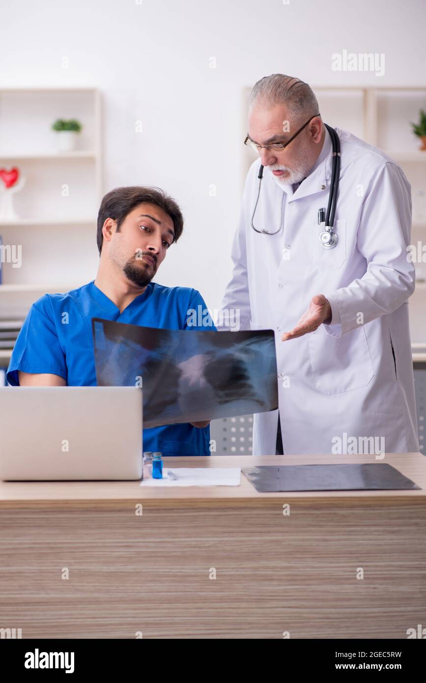 Two doctors working in the clinic Stock Photo - Alamy