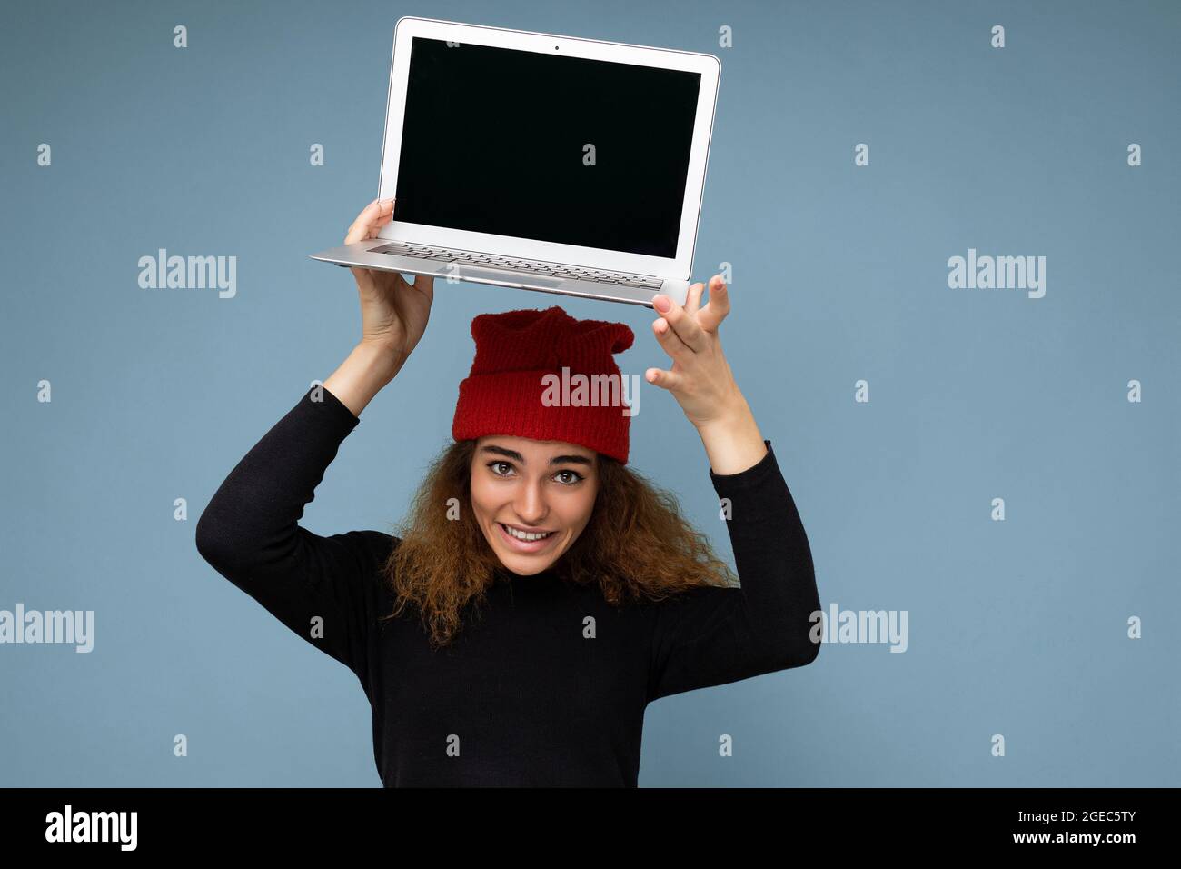 Close-up portrait of beautiful funny self-confident dark blond curly ...
