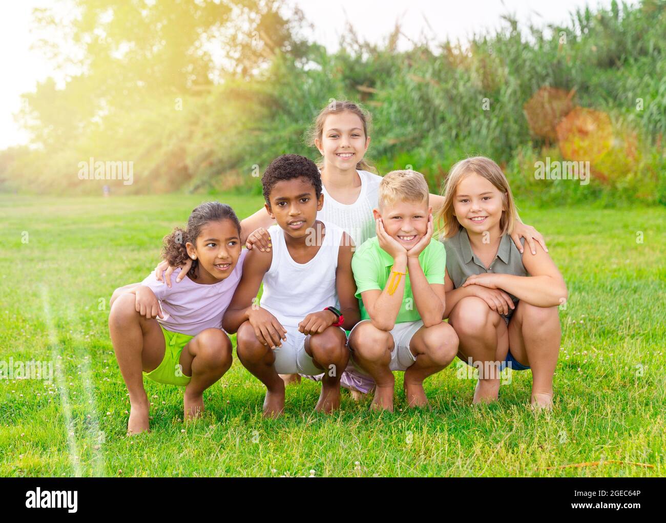 Children on grass Stock Photo - Alamy