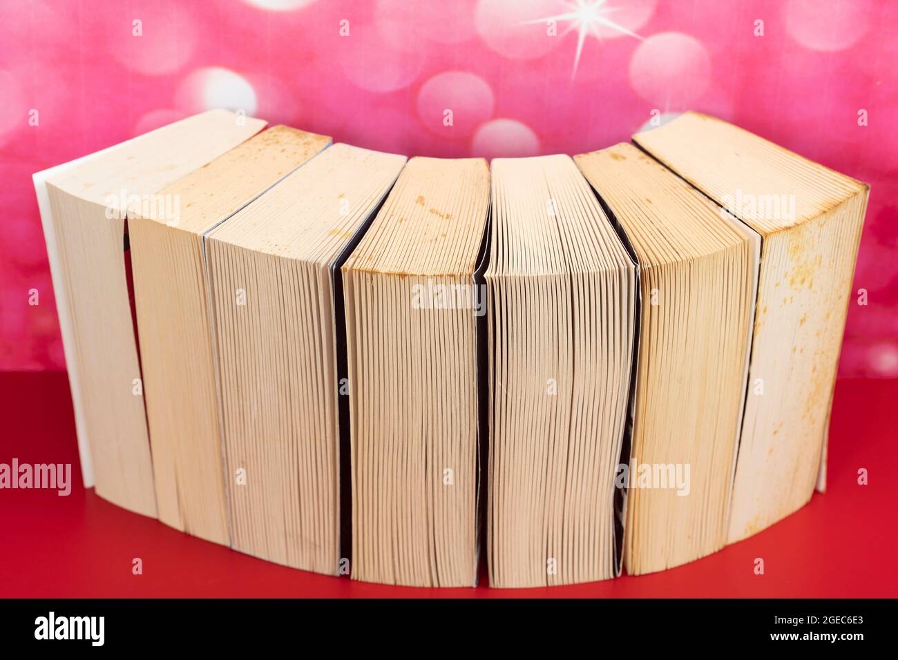 Close-up of a stack of books in a half circle fan formation. Selective ...