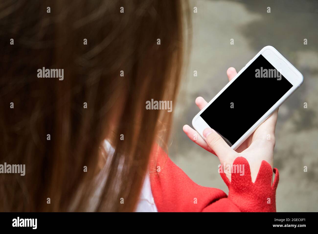 Pretty girl outdoors. Real people using mobile phone. Single female ...