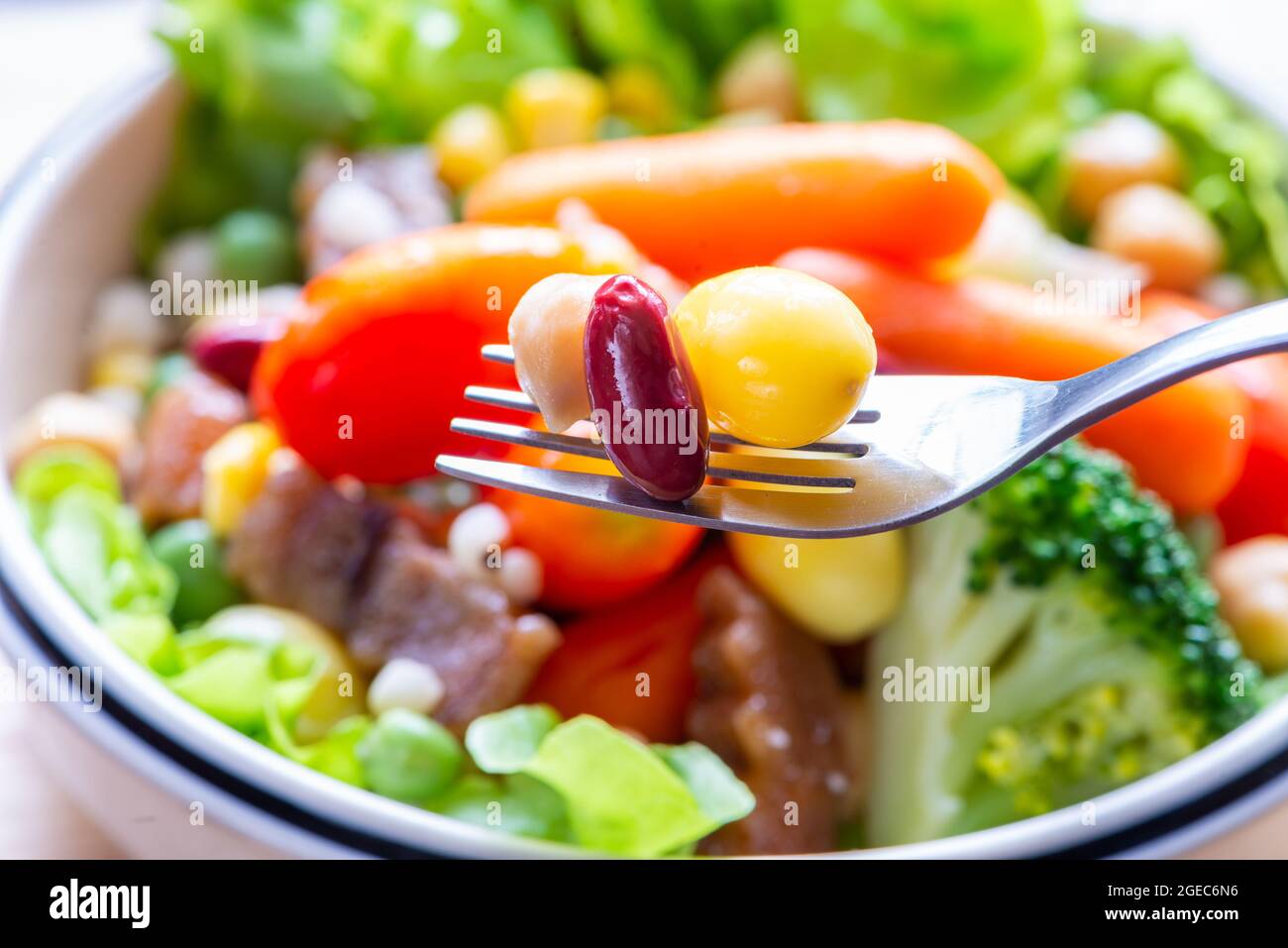 Close up red bean, nut, Ginkgo biloba on fork. Blurred background of ...