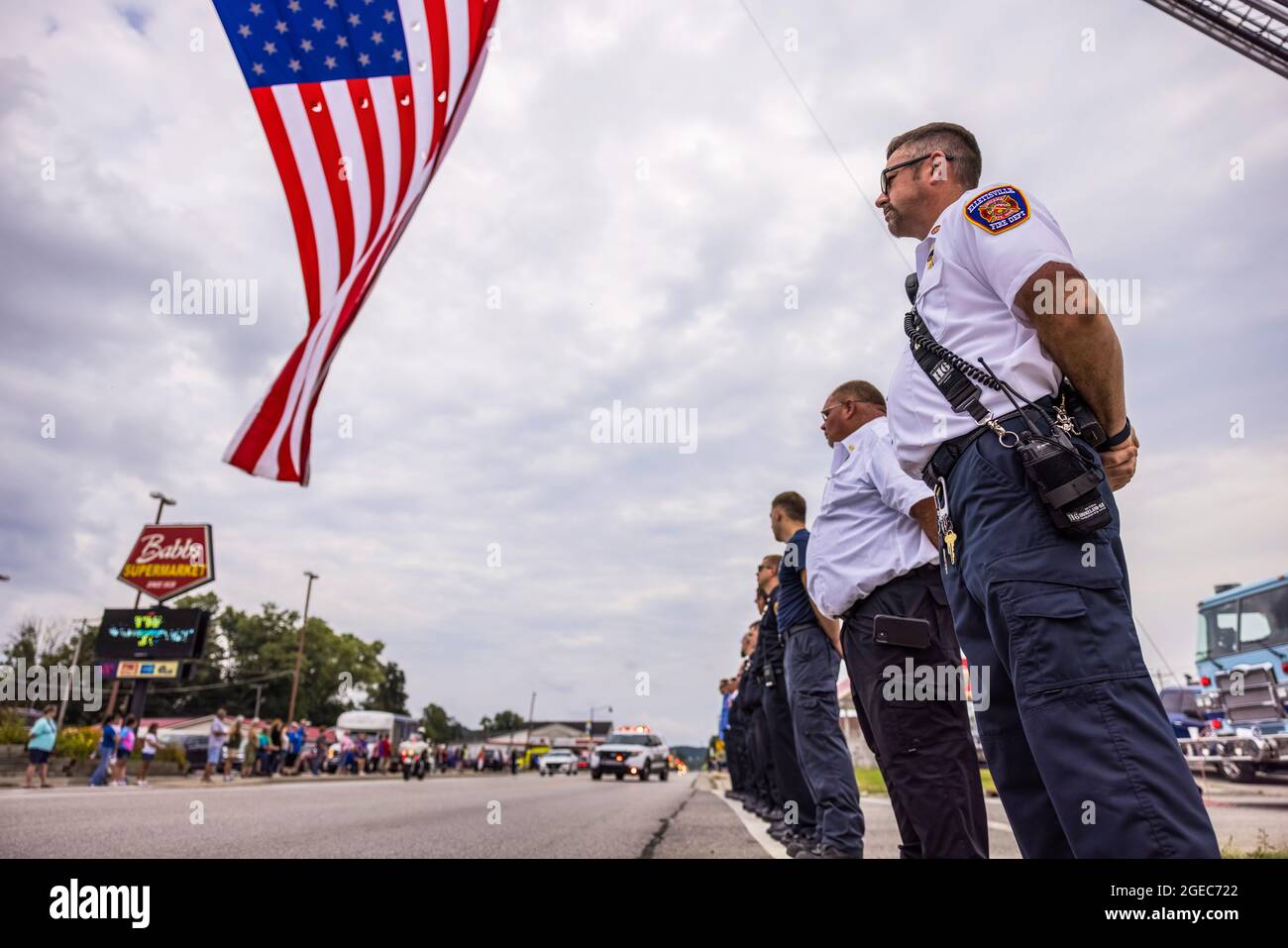 An American flag is flown over W. Morgan Street during a funeral ...