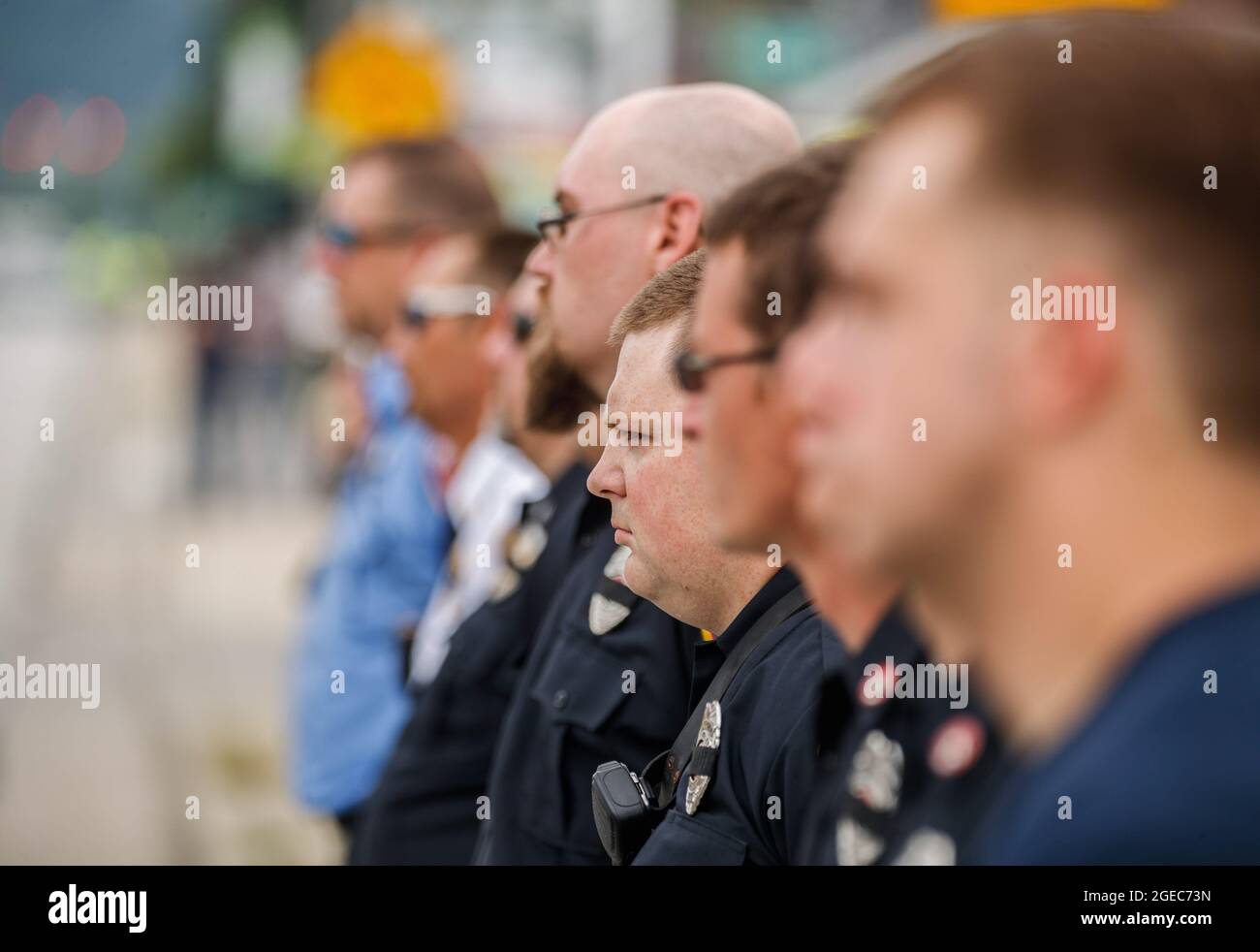 Firefighters line up on W. Morgan Street during the funeral procession ...