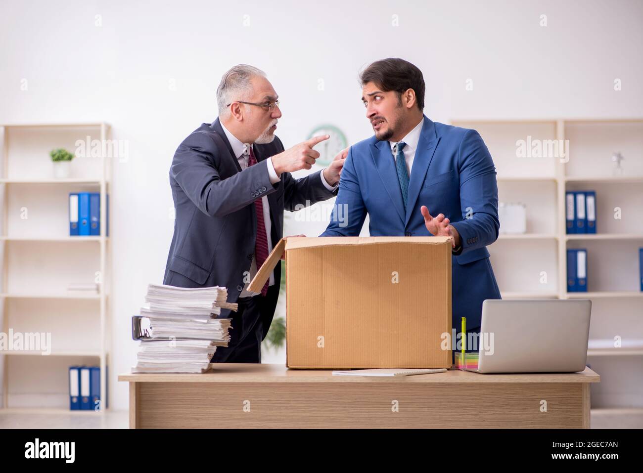 Two employees in dismissal concept Stock Photo - Alamy