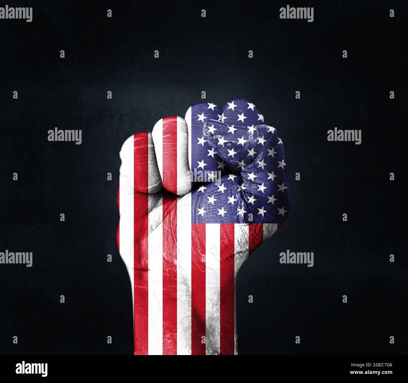 Fist is Painted with American Flag on Dark Background with copy space ...