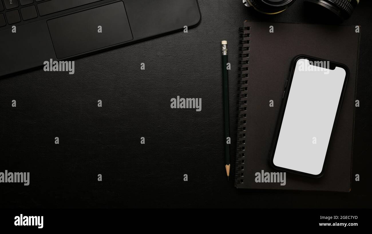 Closeup, top view, modern dark study table, minimal style, smartphone ...