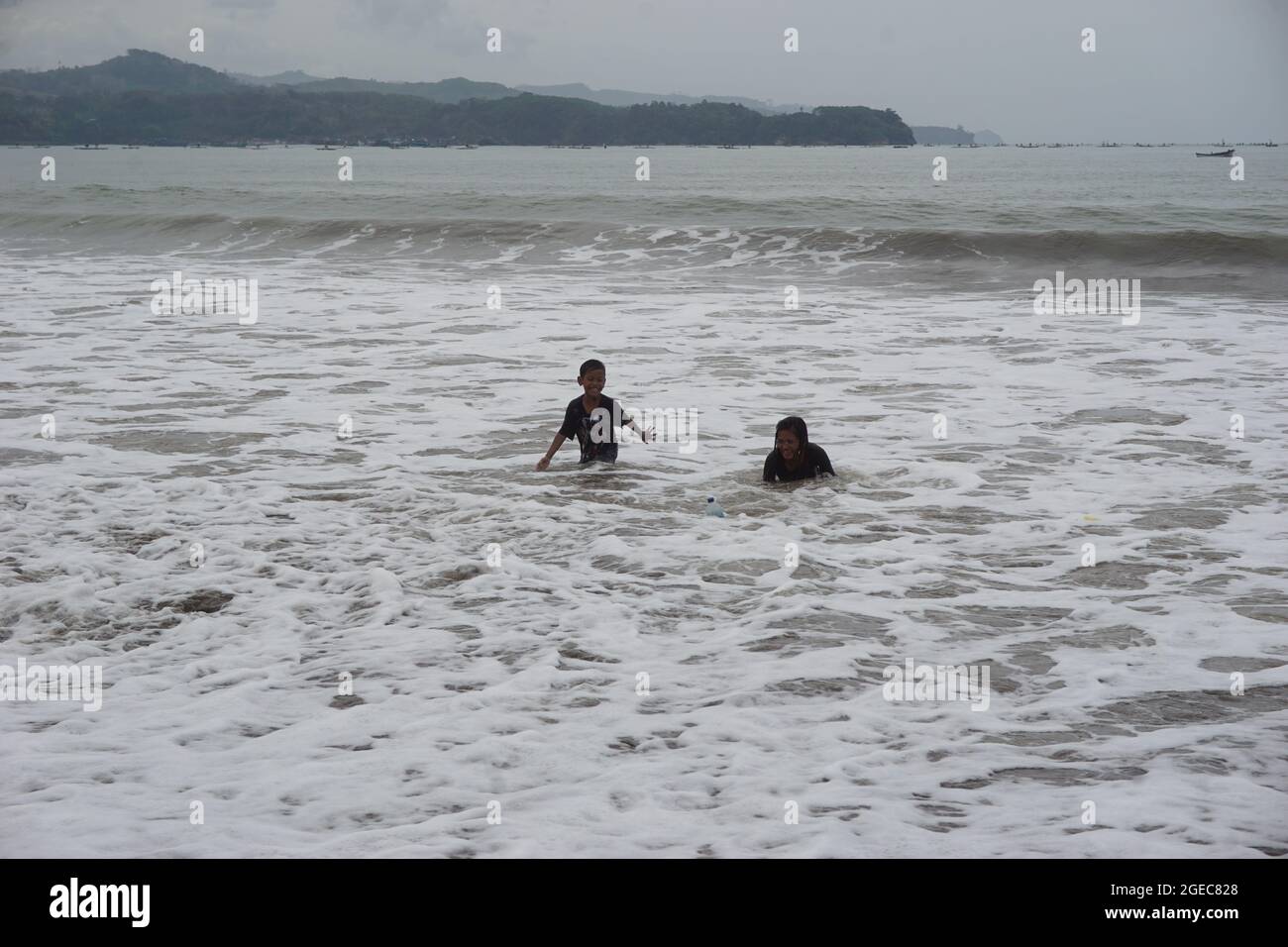 People vacation on Gemah Beach, Tulung Agung, East Java Indonesia Stock ...