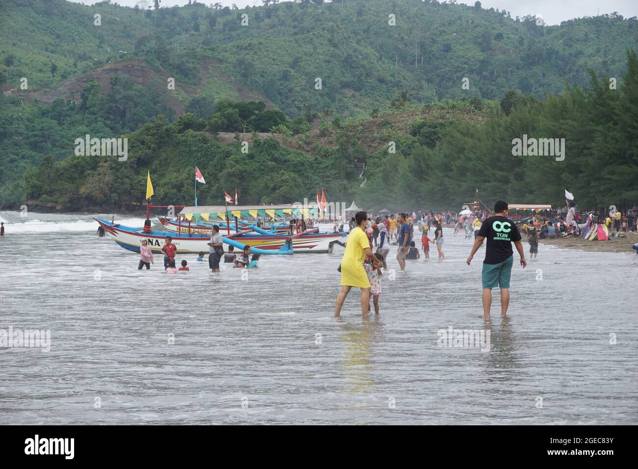 People vacation on Gemah Beach, Tulung Agung, East Java Indonesia Stock ...