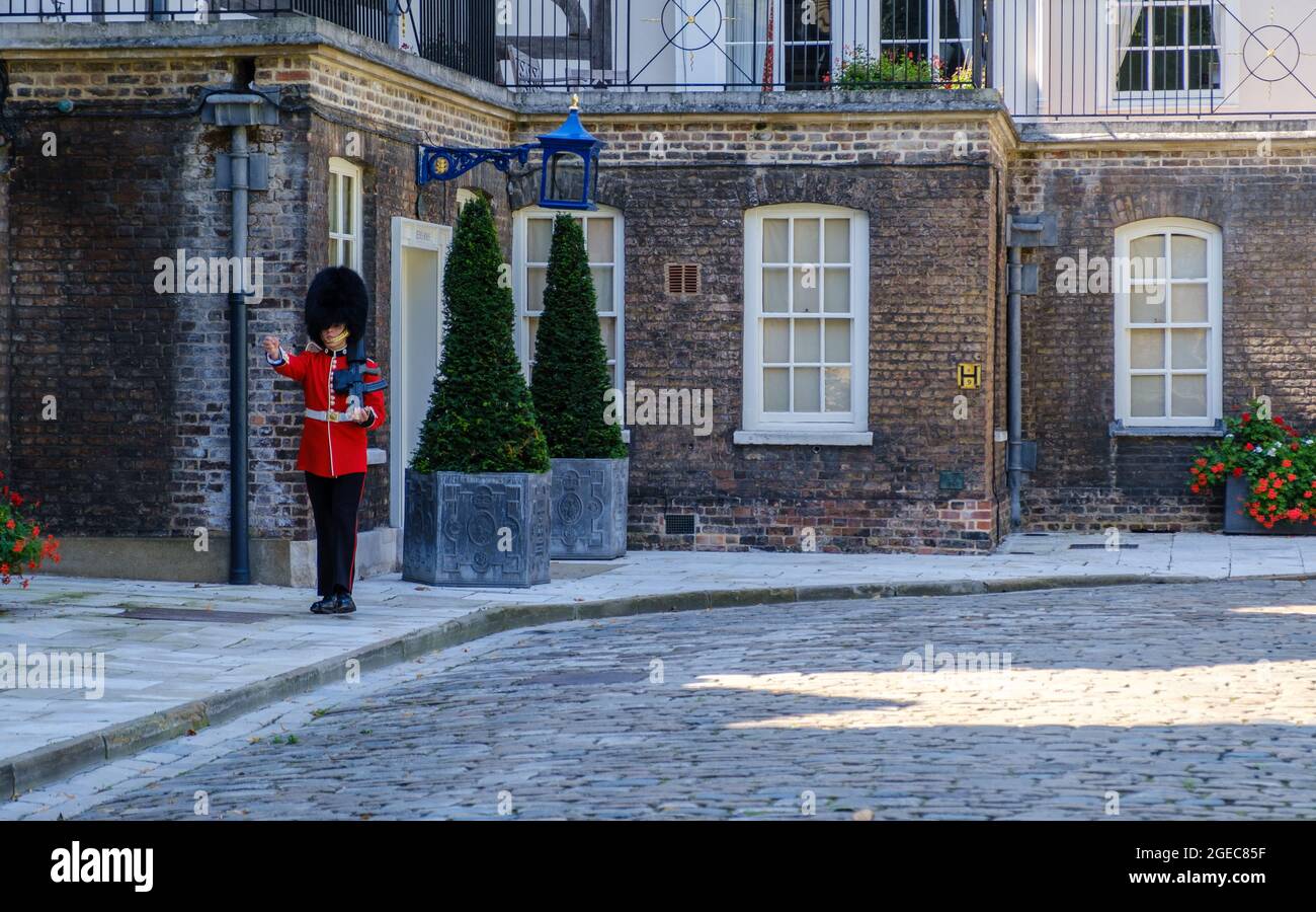 Staycation idea. Coldstream Guards sentry in military dress holding a ...