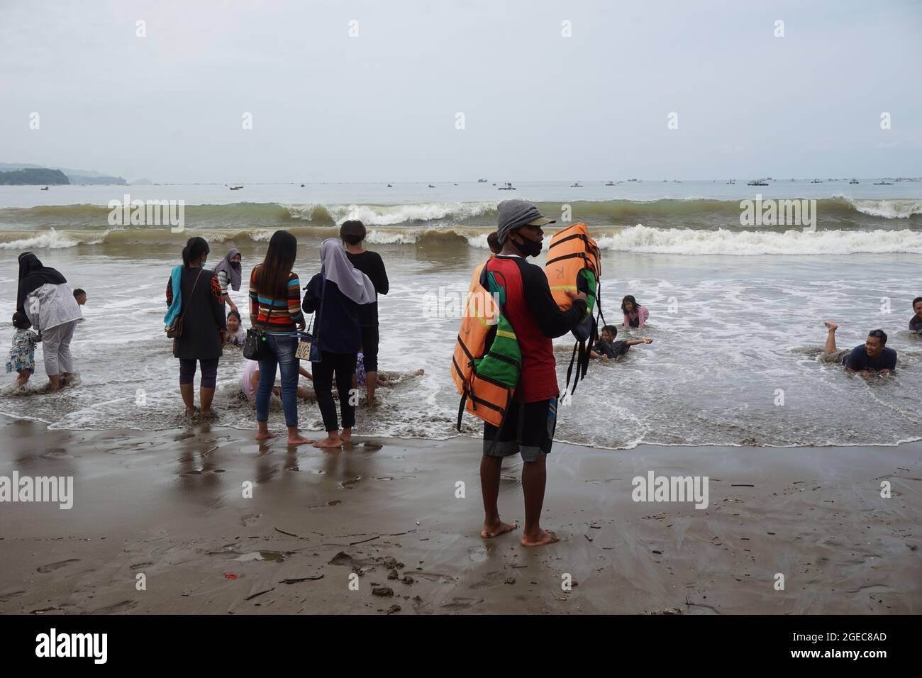 People vacation on Gemah Beach, Tulung Agung, East Java Indonesia Stock ...