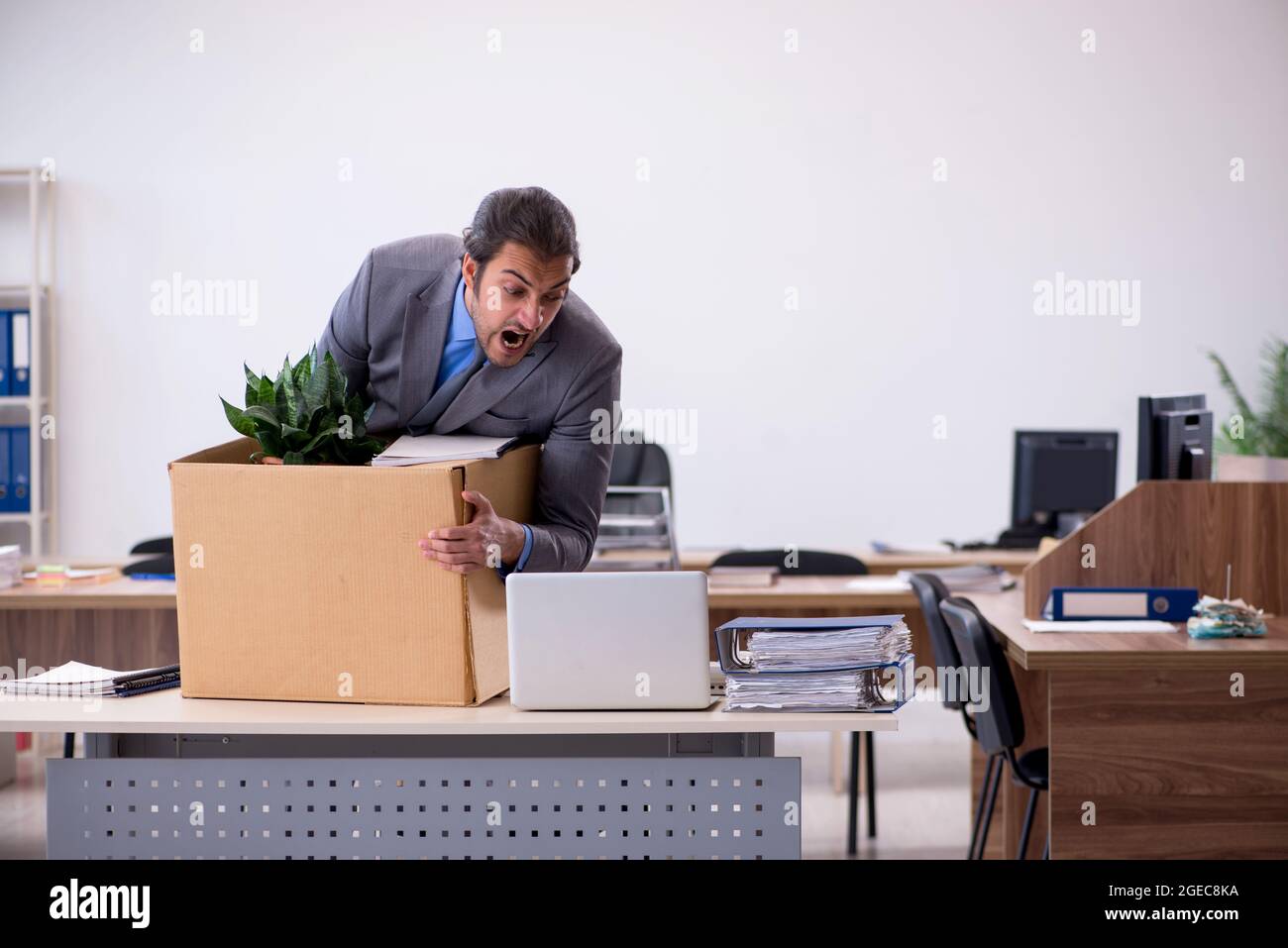 Young employee being fired from his work Stock Photo - Alamy