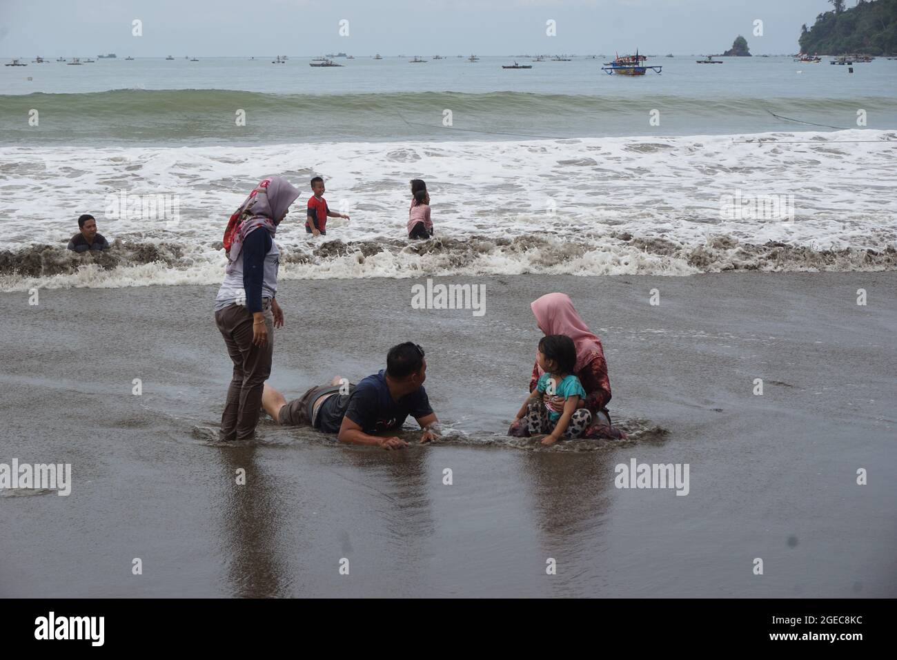 People vacation on Gemah Beach, Tulung Agung, East Java Indonesia Stock ...