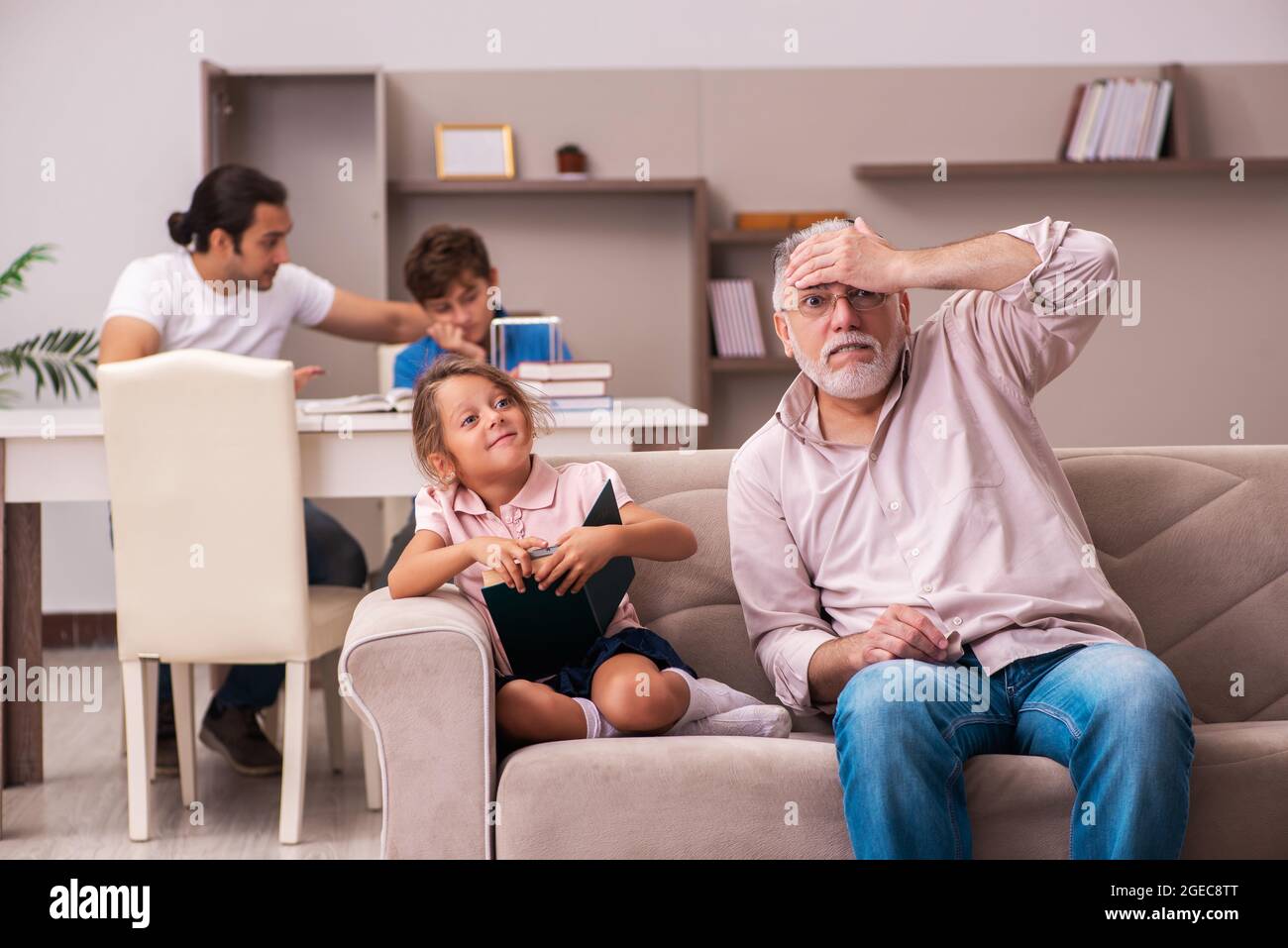 Three generations at home in early development concept Stock Photo - Alamy