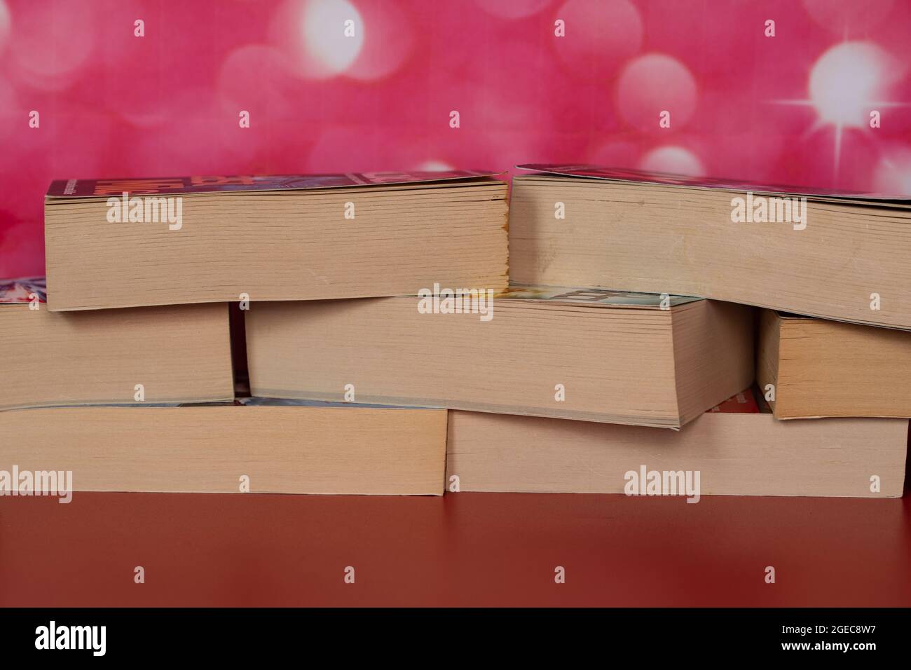 Stack of books arranged randomly on top of each other. Selective focus ...