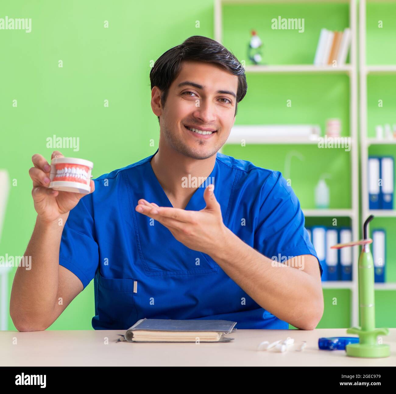 The man dentist working on new teeth implant Stock Photo - Alamy