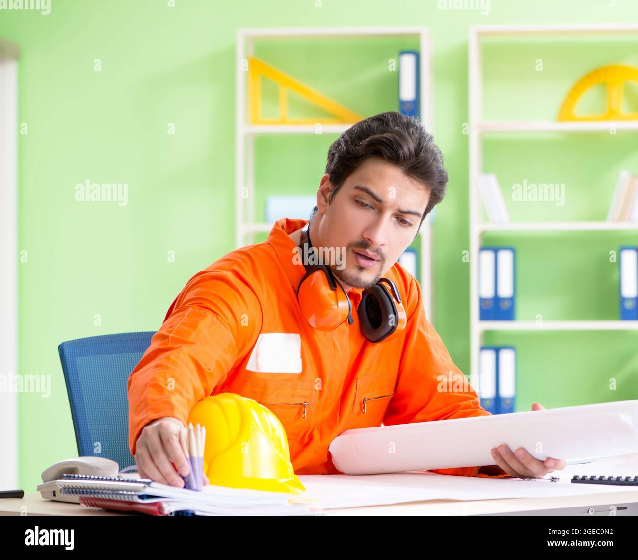 The construction supervisor planning new project in office Stock Photo ...