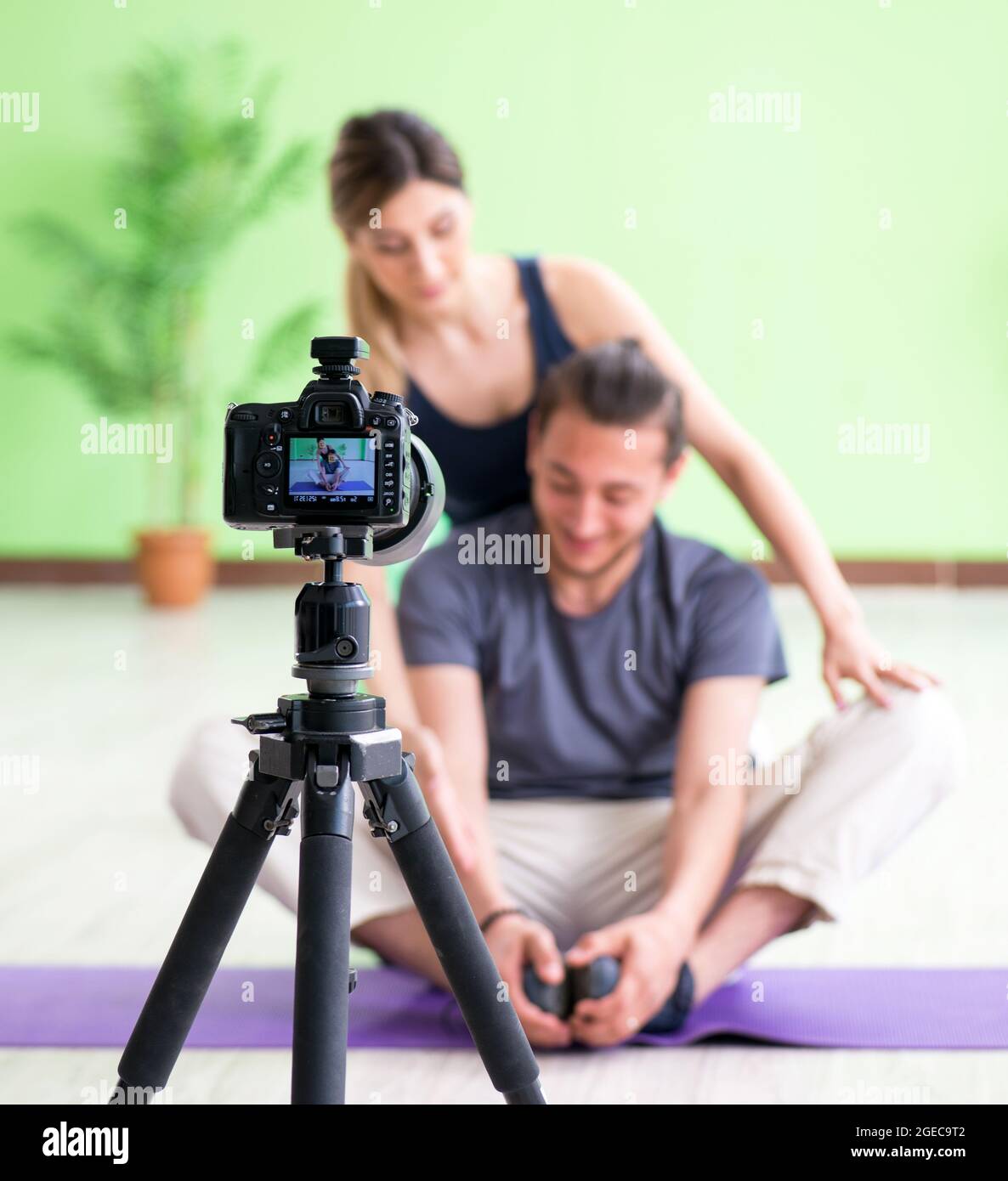 The pair recording sports video for vlog Stock Photo - Alamy