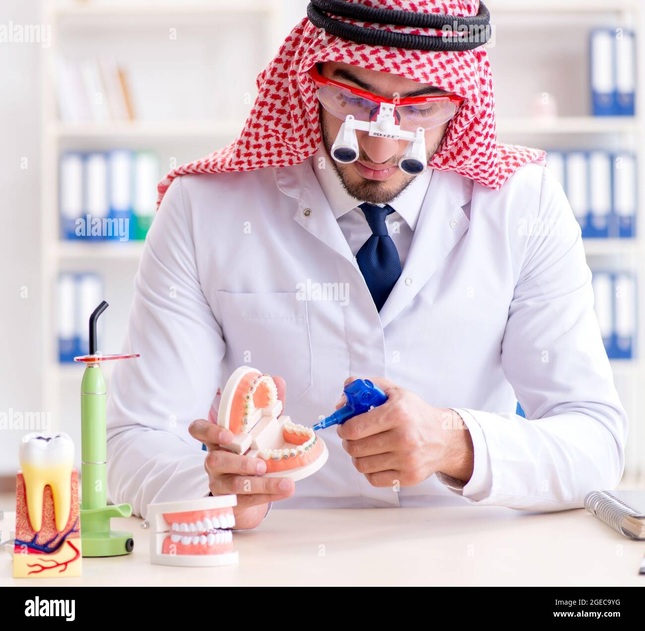 The arab dentist working on new teeth implant Stock Photo - Alamy
