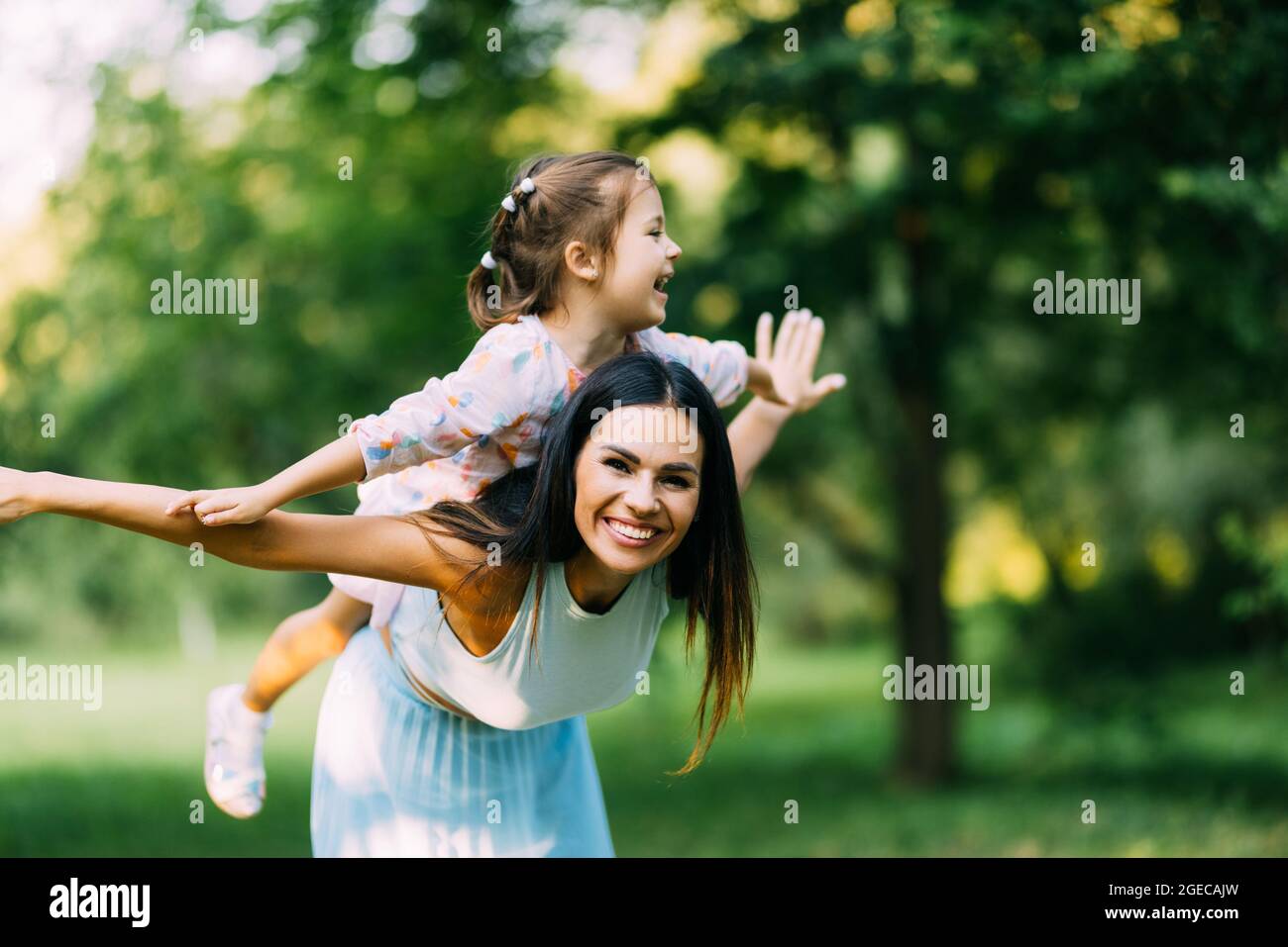 Family happy children girl kindergarten playing ride back piggyback ...