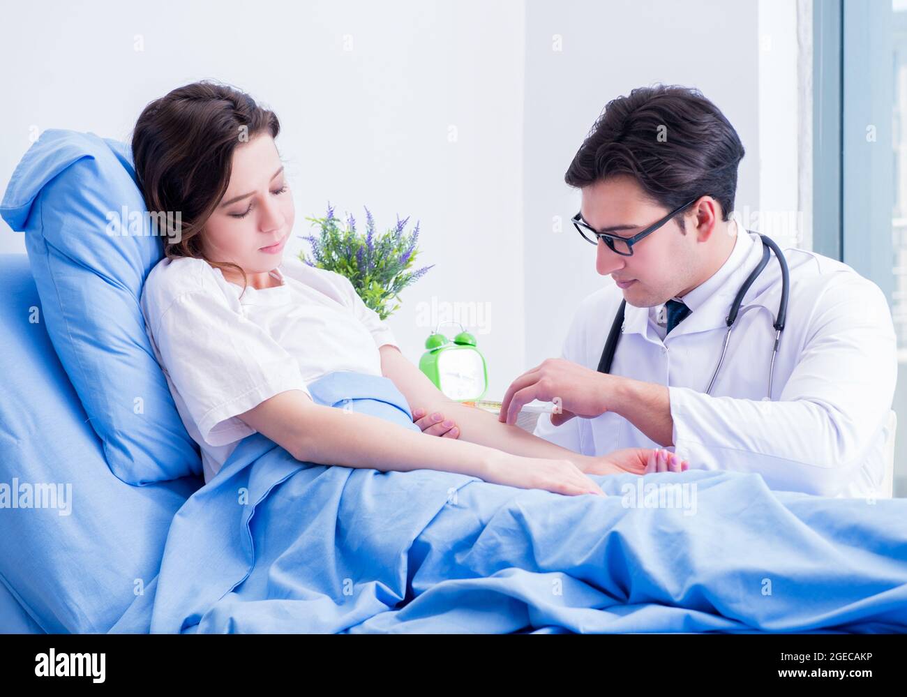The doctor doing medical injection in hospital room Stock Photo - Alamy